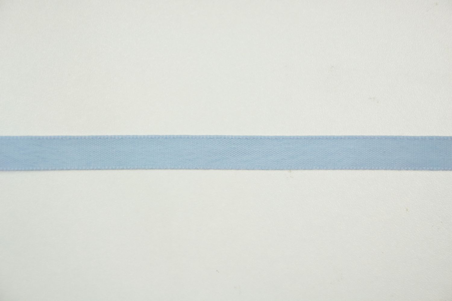 Zacht oranje, aubergine en lichtblauw. | Inpakpapier